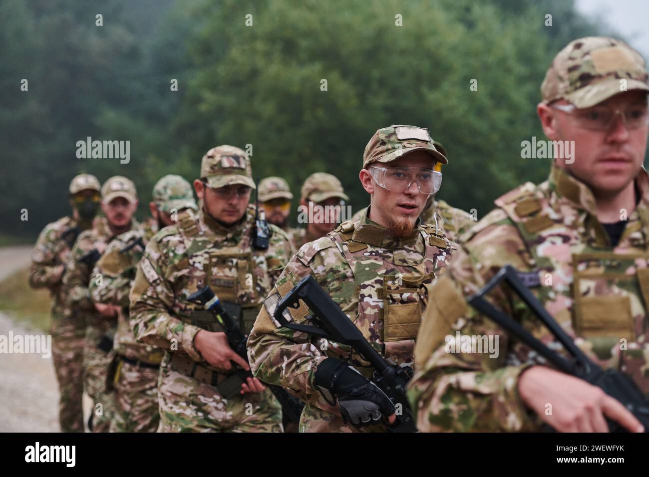 An elite military unit, led by a major, confidently parades through ...