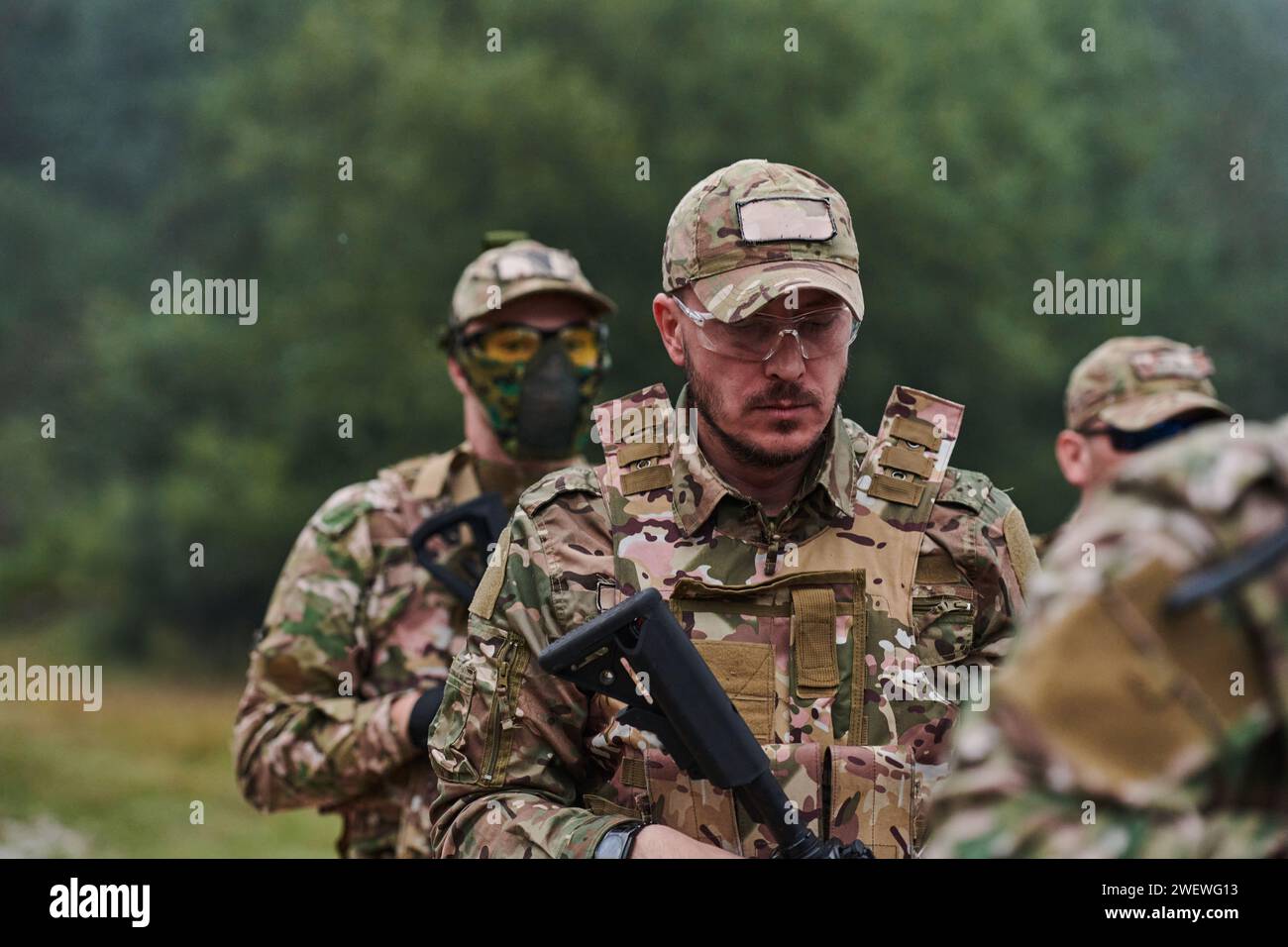 An elite military unit, led by a major, confidently parades through ...