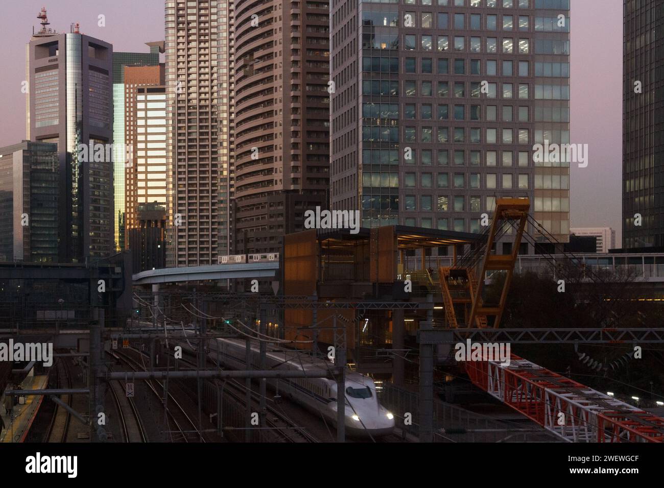 An N700 series Shinkansen or bullet train passing in front of Shiodome ...