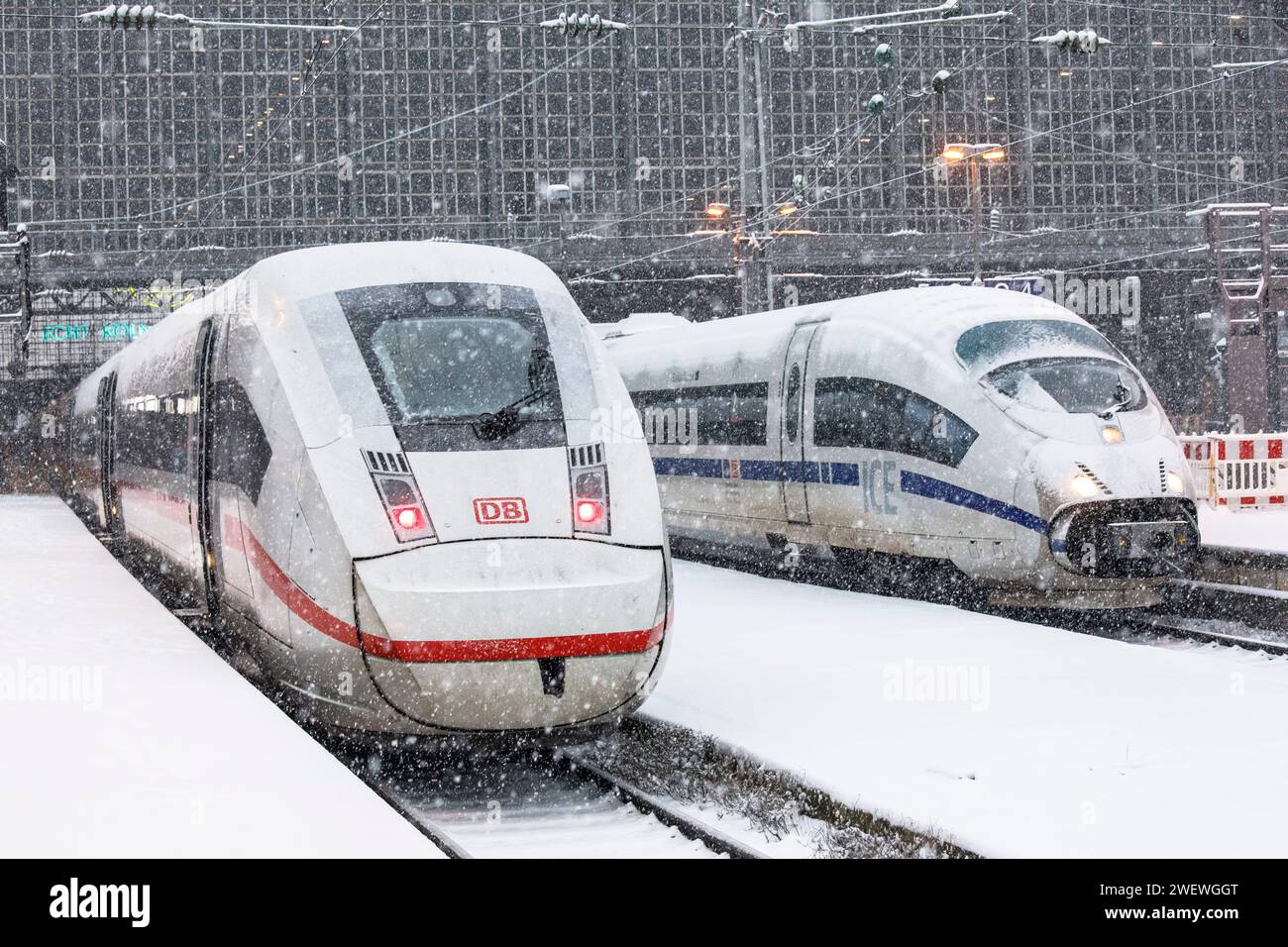 high-speed trains ICE 4 and ICE 3 at Cologne central station, snow ...