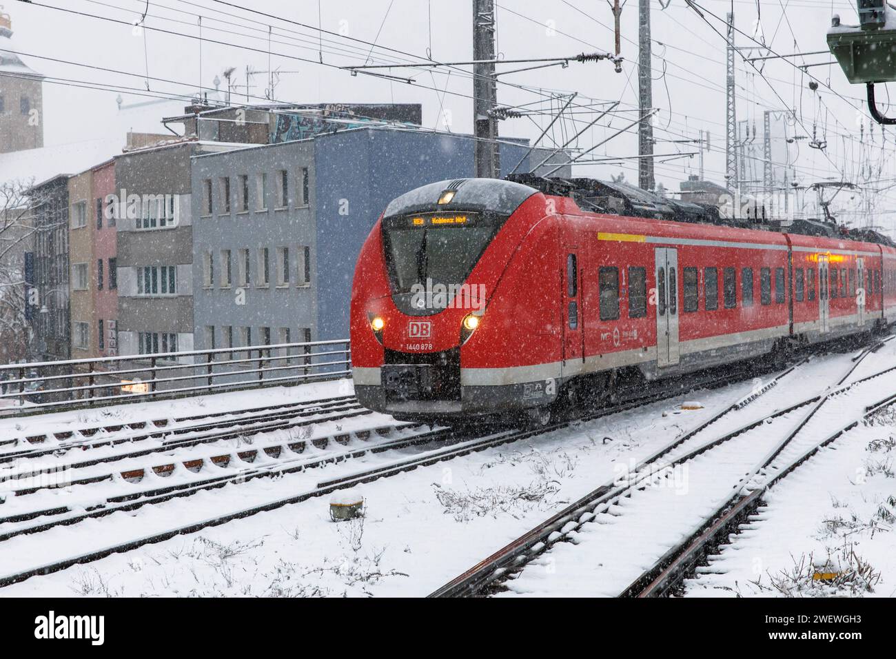 Regional Express of Deutsche Bahn arrives at central station, snow ...