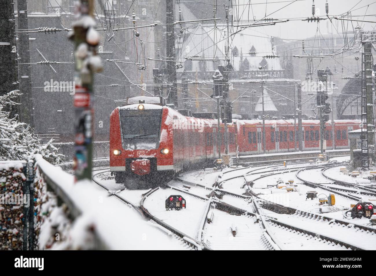 regional train is leaving Cologne central station, snow, snowfall ...