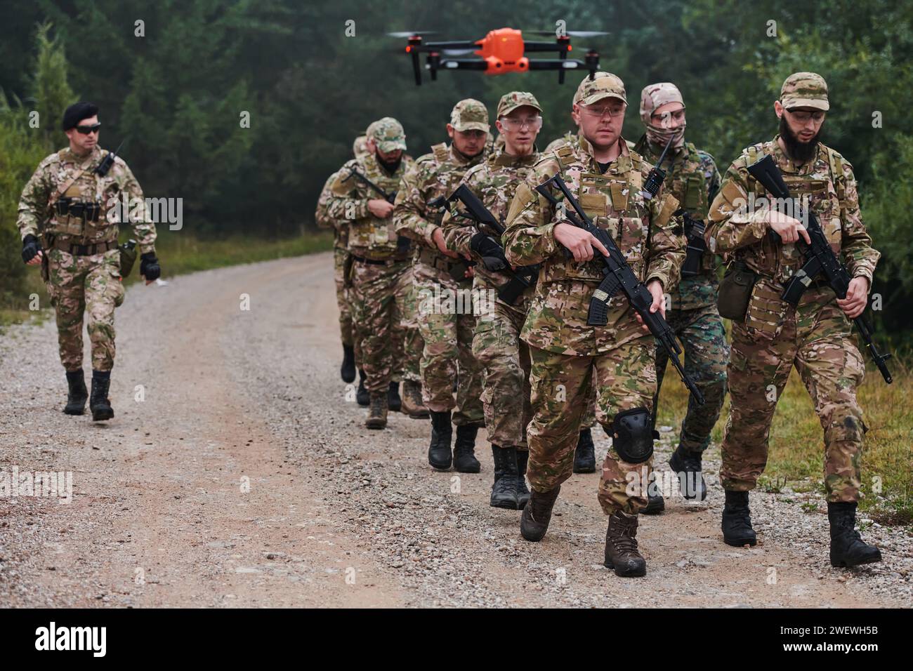 An elite military unit, led by a major, confidently parades through ...
