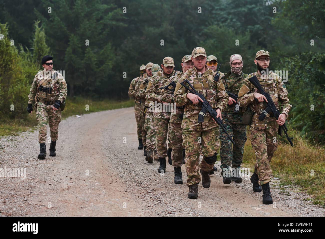 An elite military unit, led by a major, confidently parades through ...