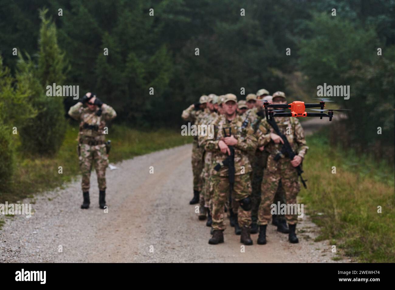 An elite military unit, led by a major, confidently parades through ...