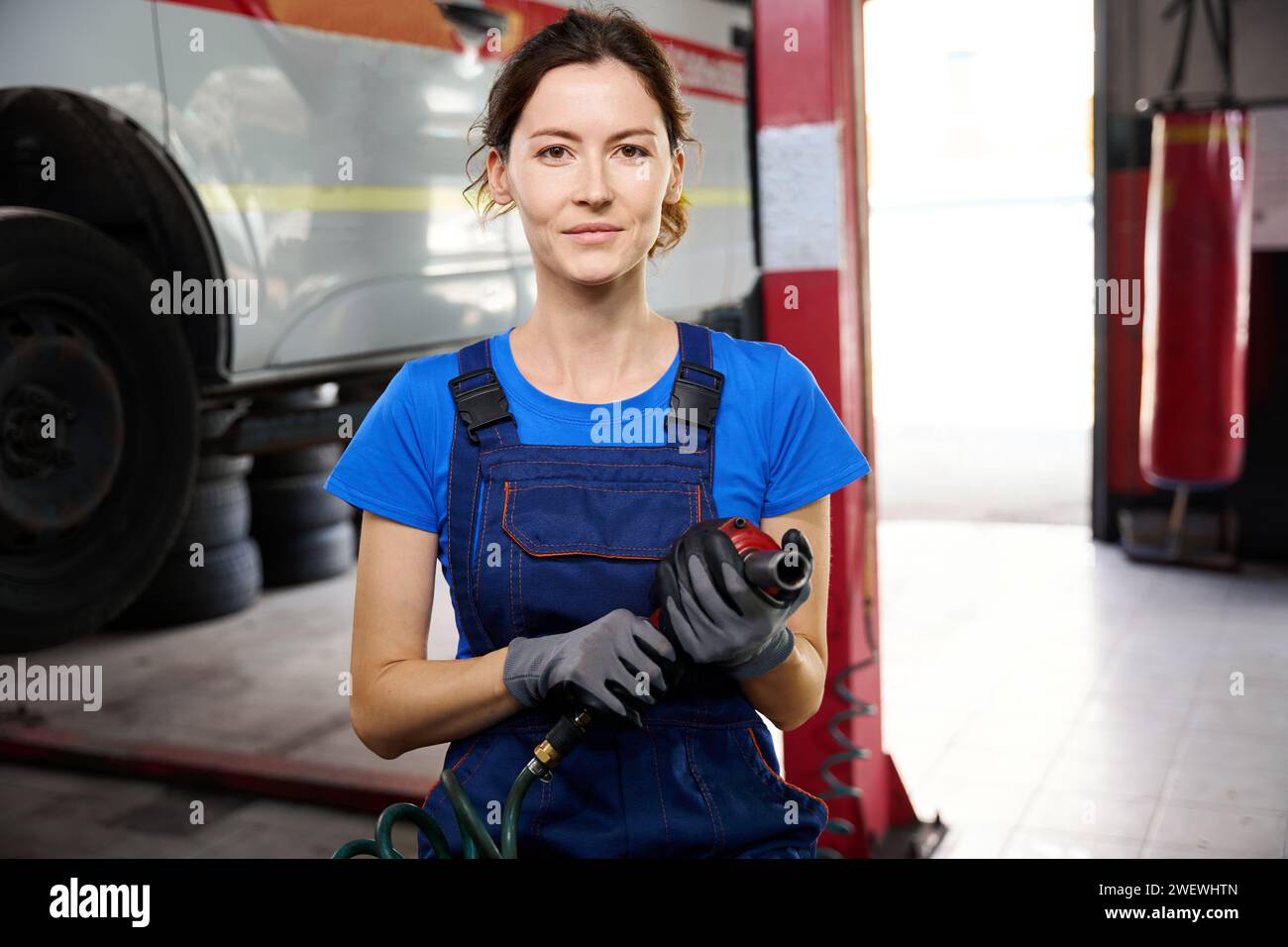 Mechanic uses pneumatic tool hi-res stock photography and images - Alamy