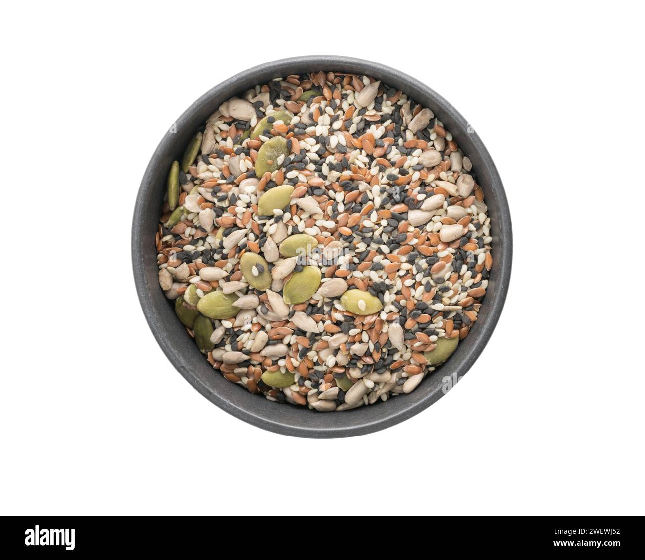 Top view of seed mix for salad in black bowl isolated on white ...