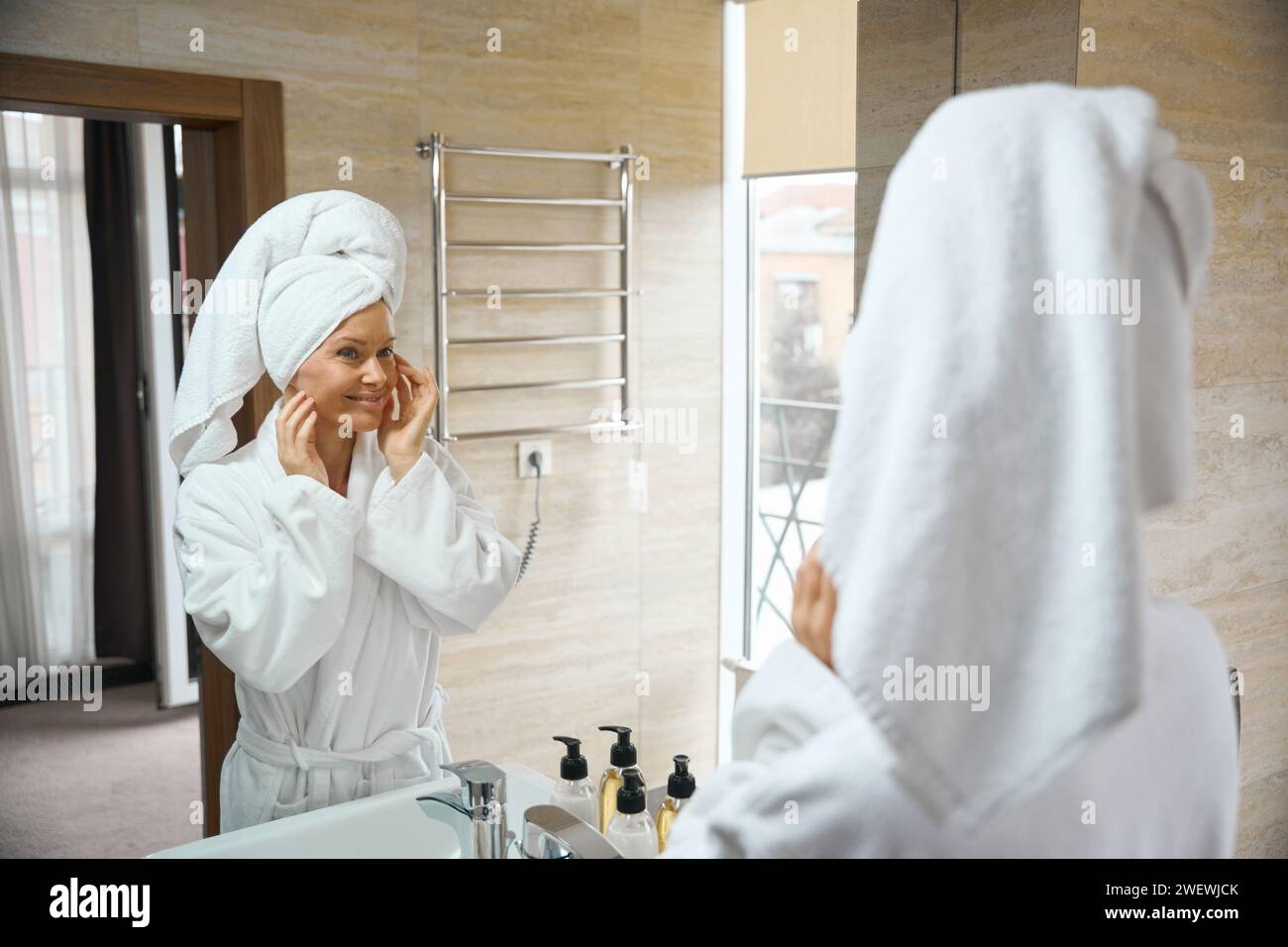 Woman admiring reflection in mirror hi-res stock photography and images ...