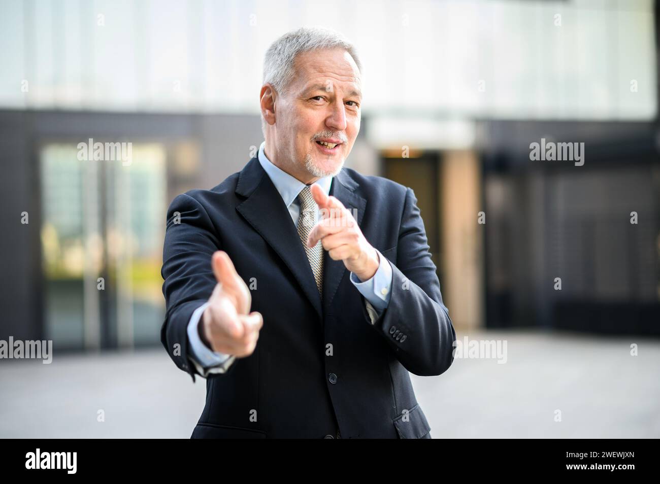 Senior businessman pointing finger camera hi-res stock photography and ...
