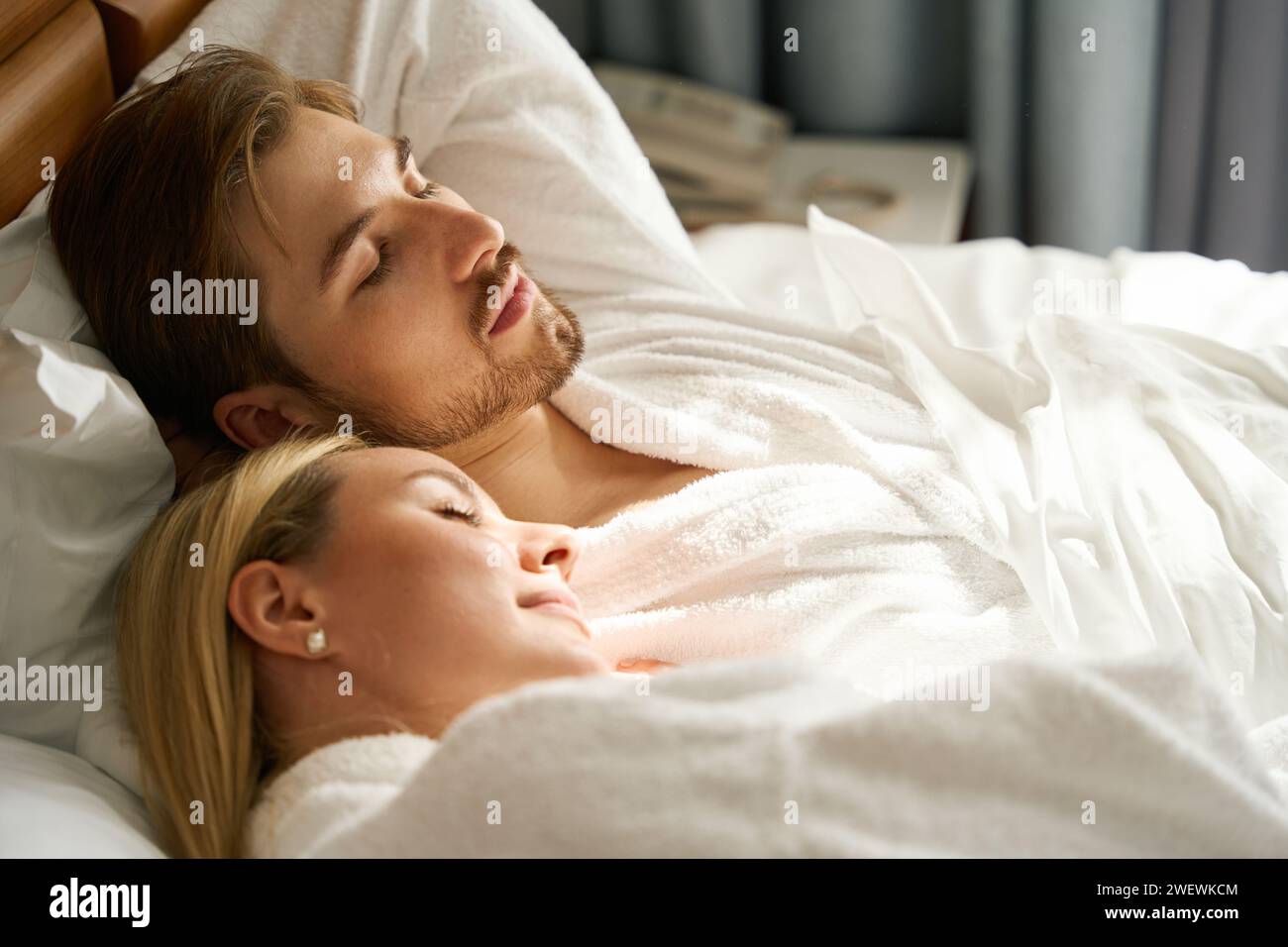 Smiling wife dozing on her beloved husbands shoulder Stock Photo - Alamy