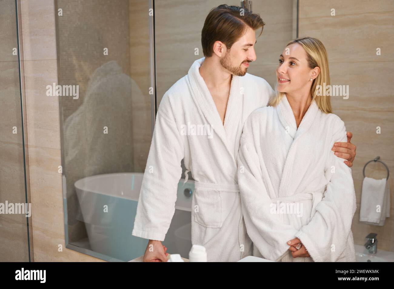 Happy couple stands hugging in the bathroom Stock Photo - Alamy