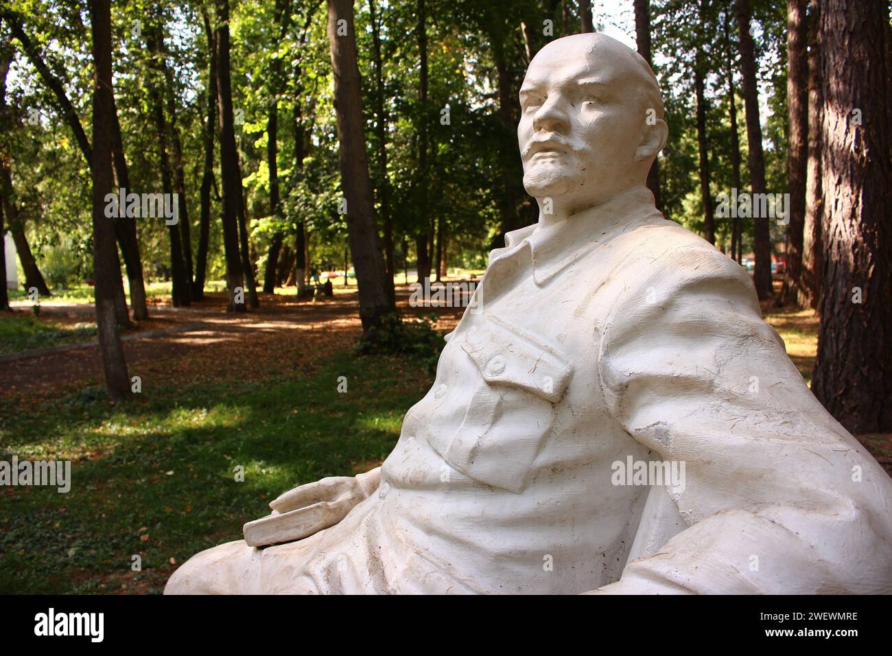 Monument to Lenin sitting with a book on the territory of the Soviet ...