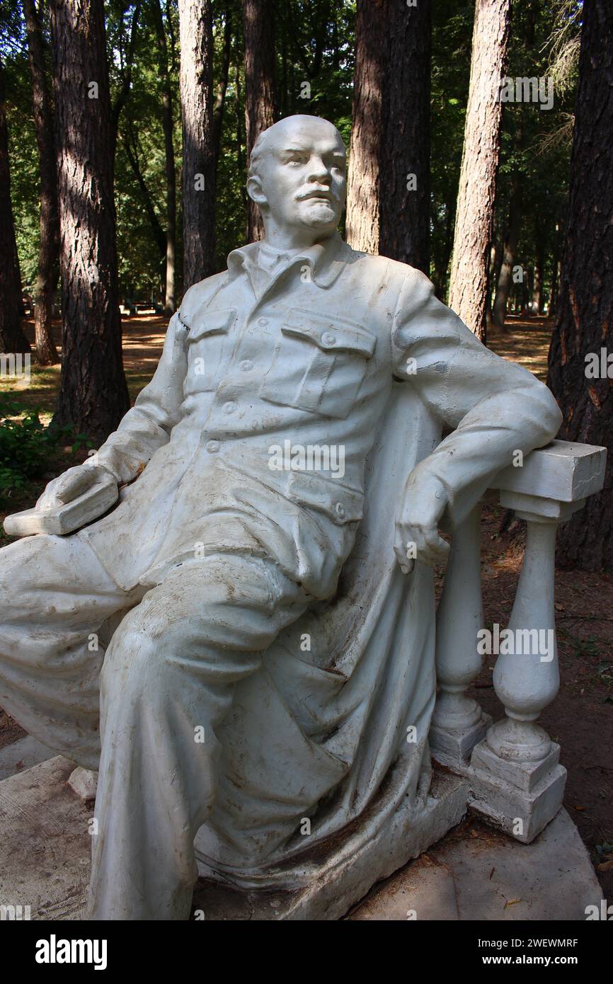 Monument to Lenin sitting with a book on the territory of the Soviet ...