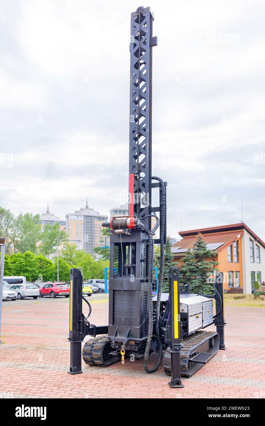 Construction platform on rubber crawler tracks with a winch, metal boom ...