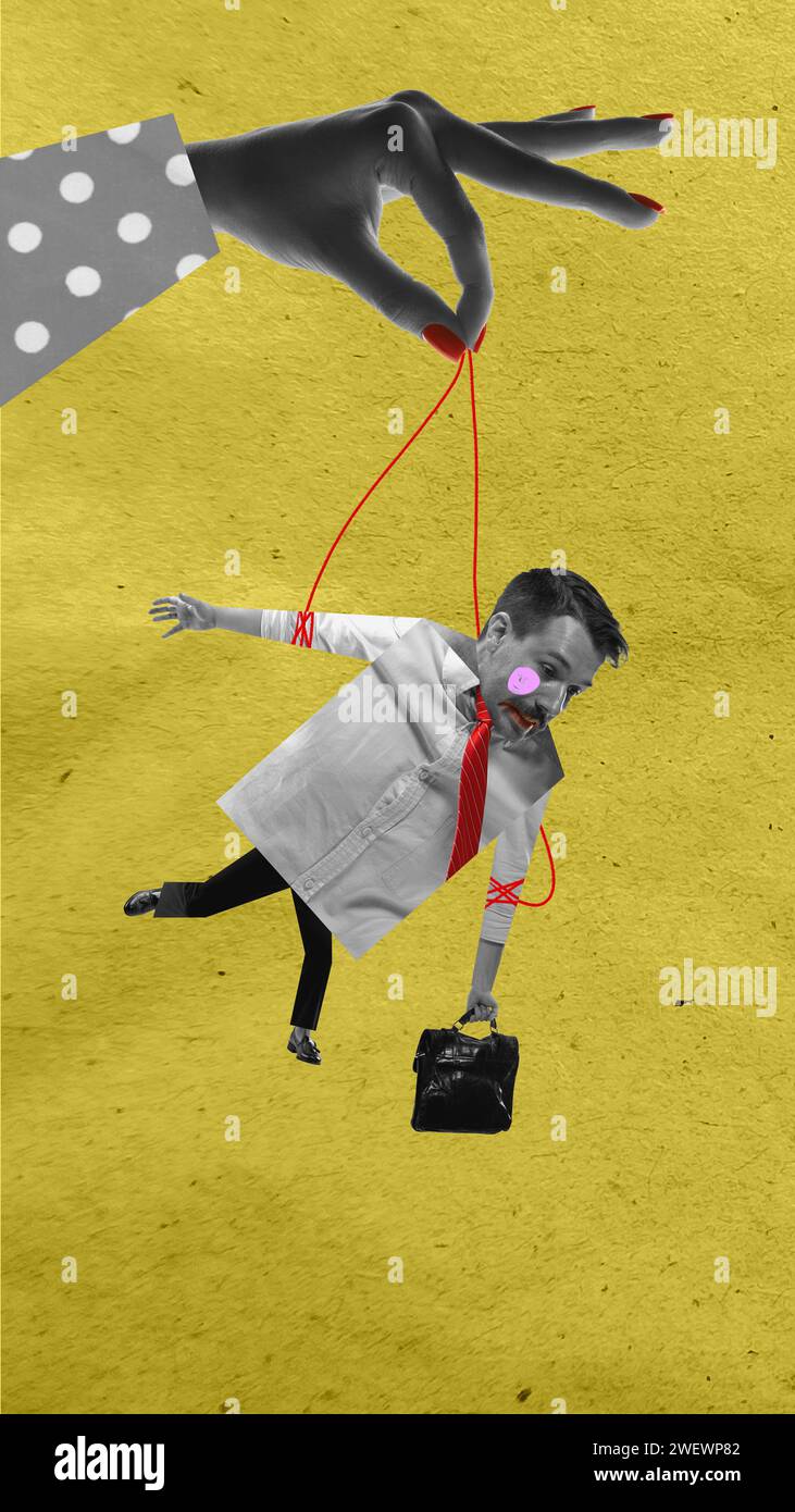 Young man hanging on string that female hand holding. Manipulation and ...