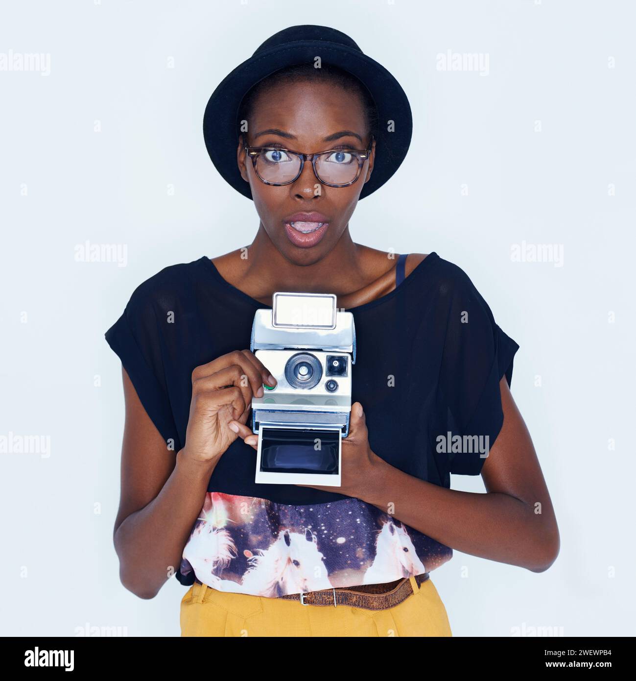 Woman, picture and camera in studio with shock, creativity and vintage ...