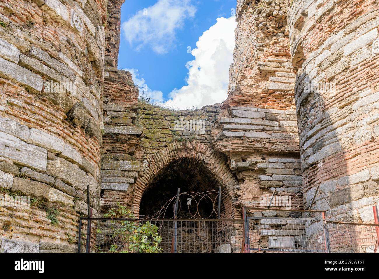 Entrance archway into ruins of ancient castle built between two towers ...