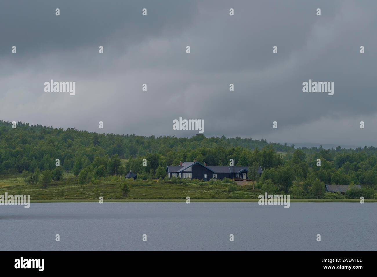 Cabin at Lake Aenevatnet in the rain, landscape format, inland waters ...