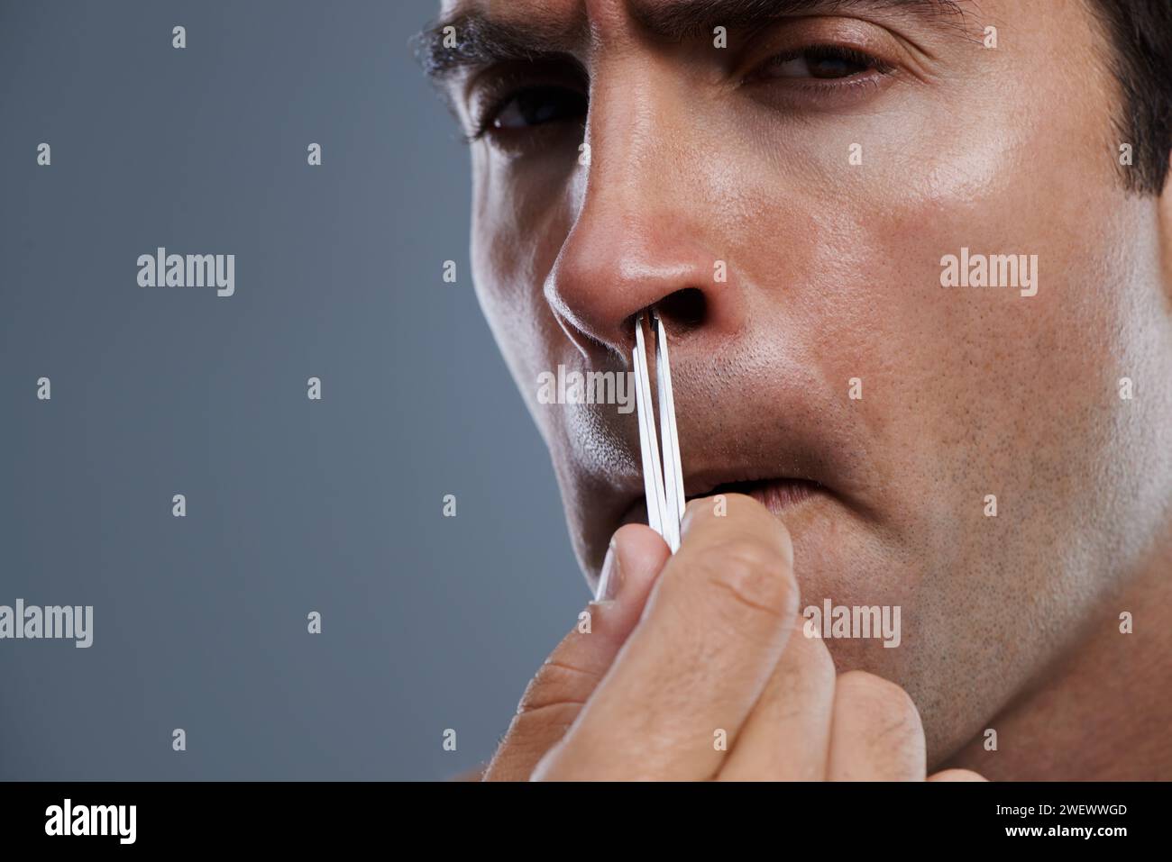 Nose, hair removal and portrait of man closeup with pain from cleaning ...