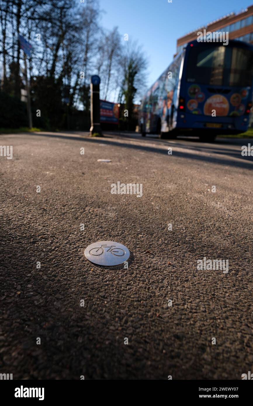 Metal disk pavement National Cycle route markers through Redhill centre ...