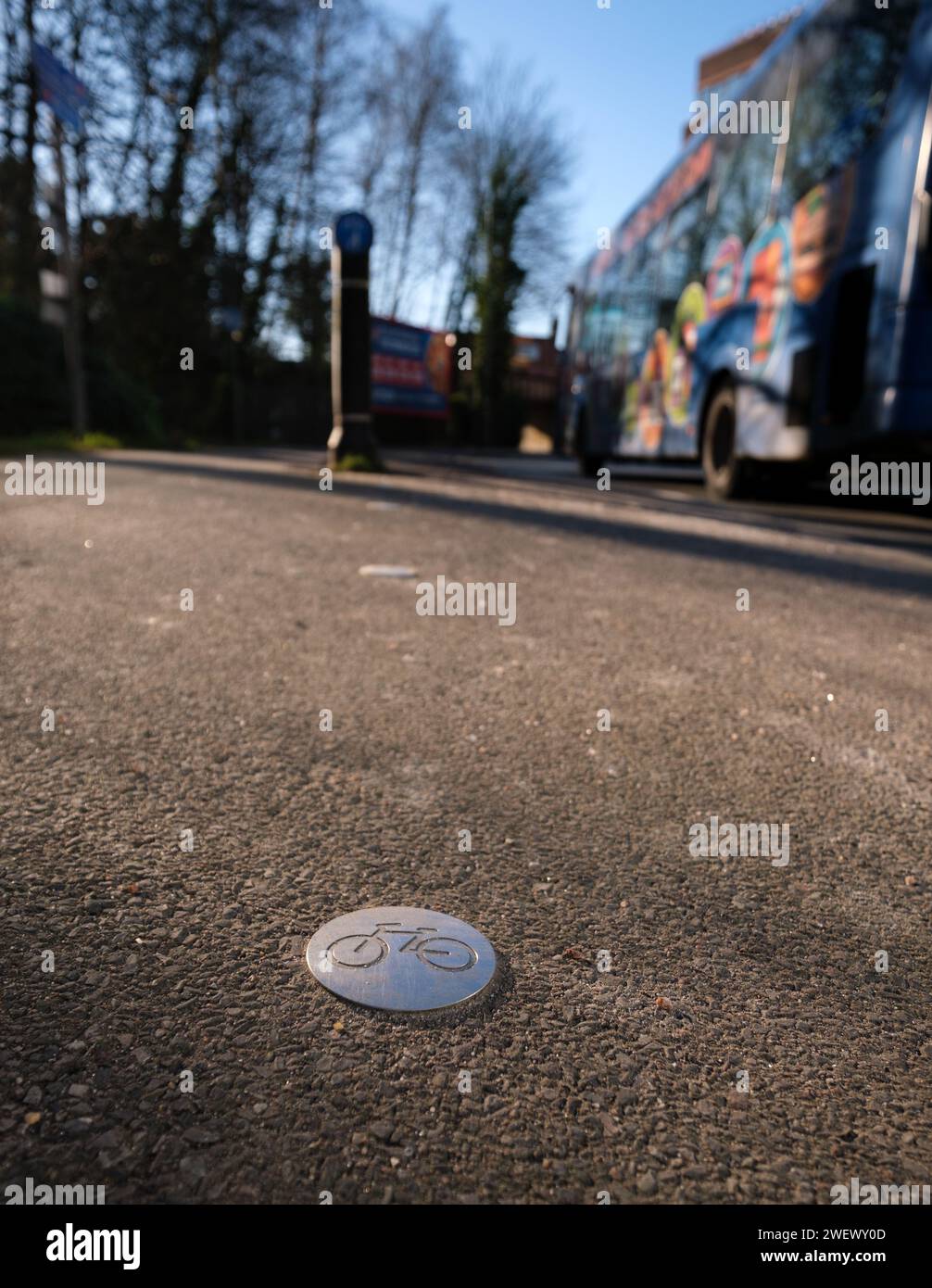 Metal disk pavement National Cycle route markers through Redhill centre ...
