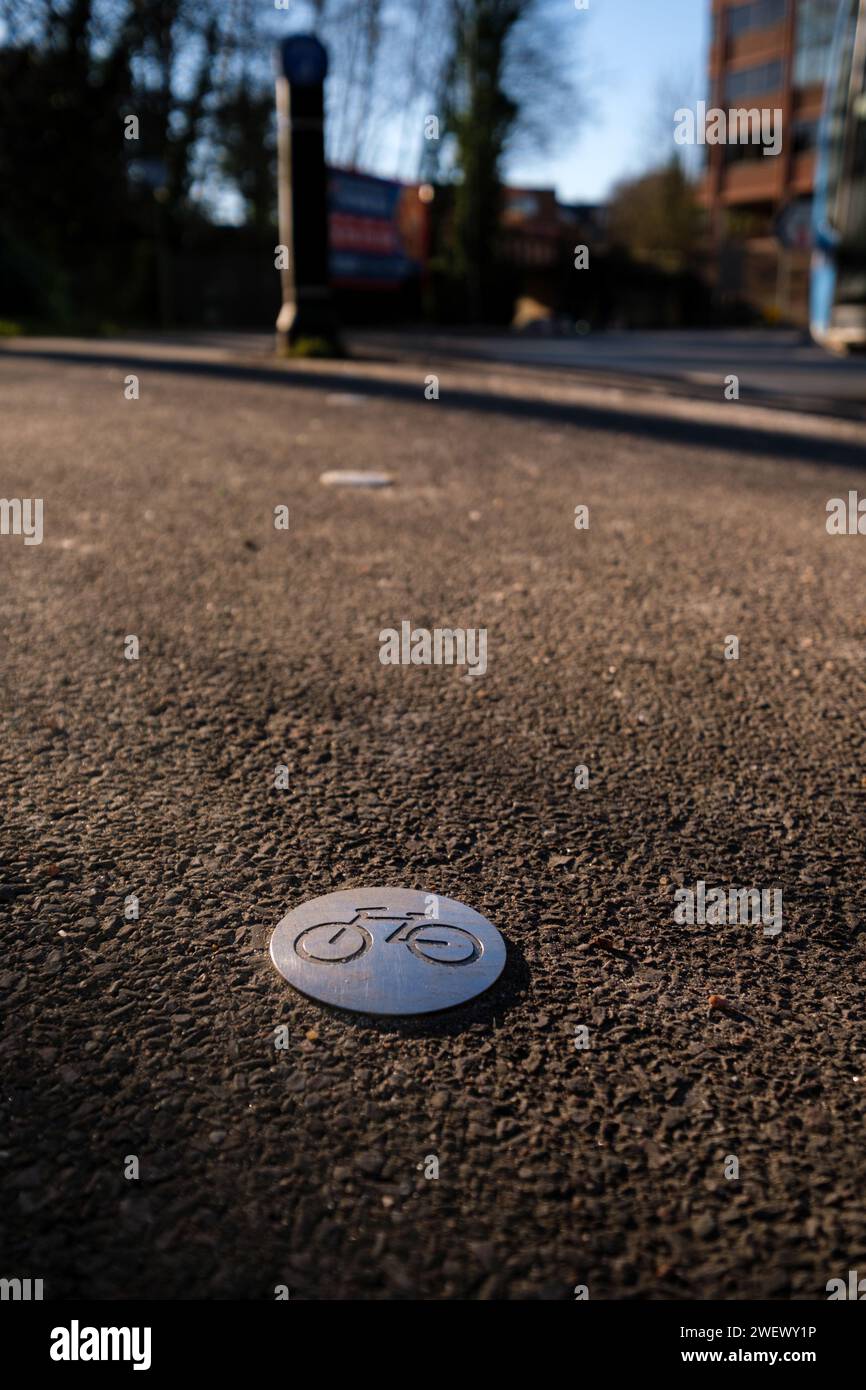Metal disk pavement National Cycle route markers through Redhill centre ...