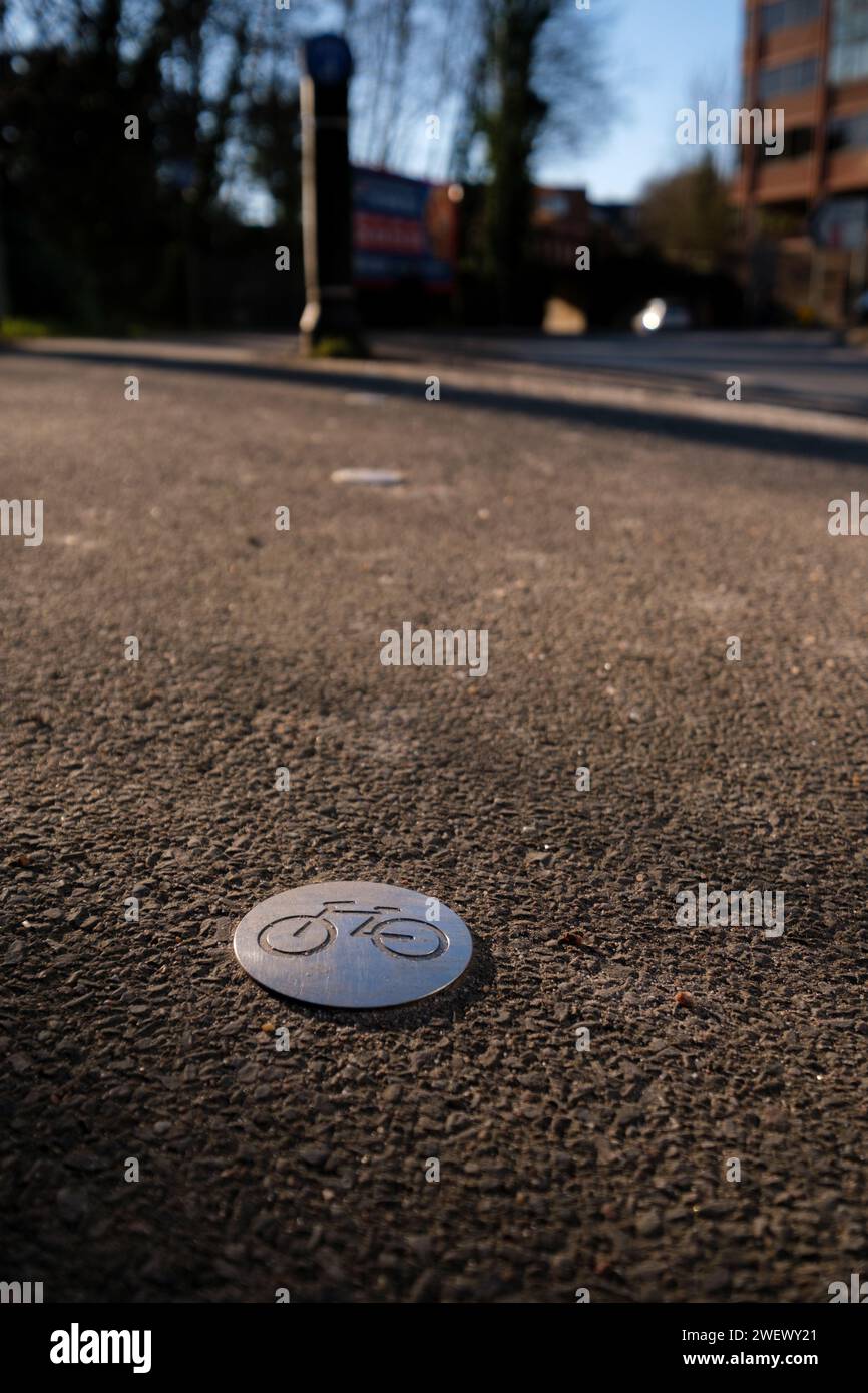 Metal disk pavement National Cycle route markers through Redhill centre ...