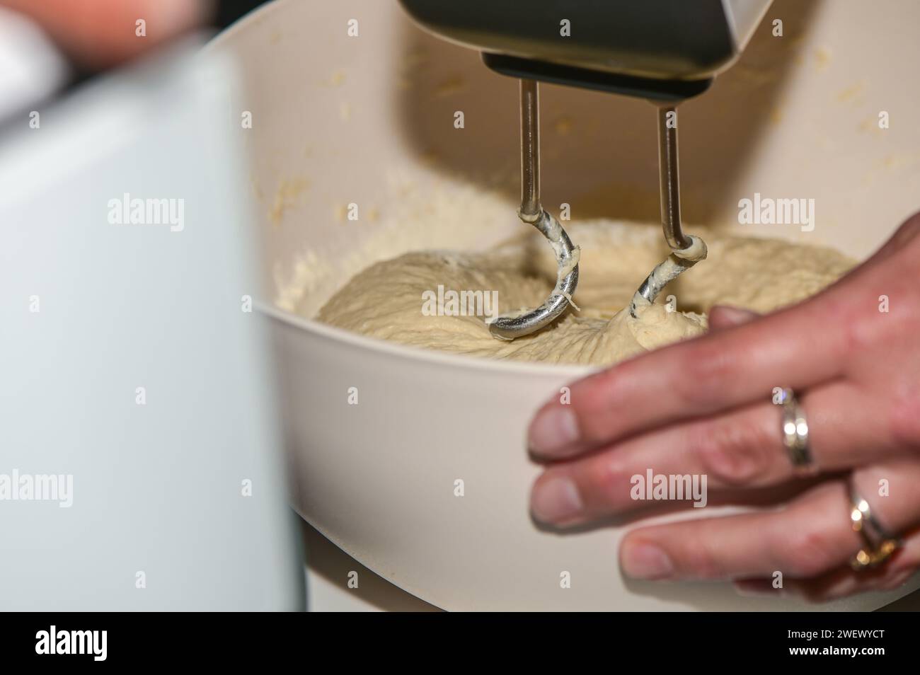 woman kneading dough with a mixer in the kitchen 11 Stock Photo - Alamy