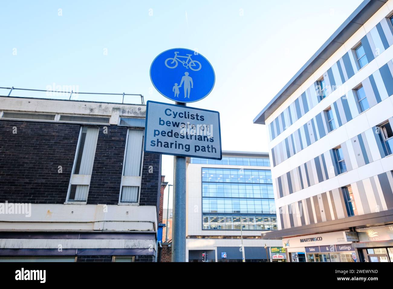 Cyclists beware of pedestrians sharing path sign hi-res stock ...