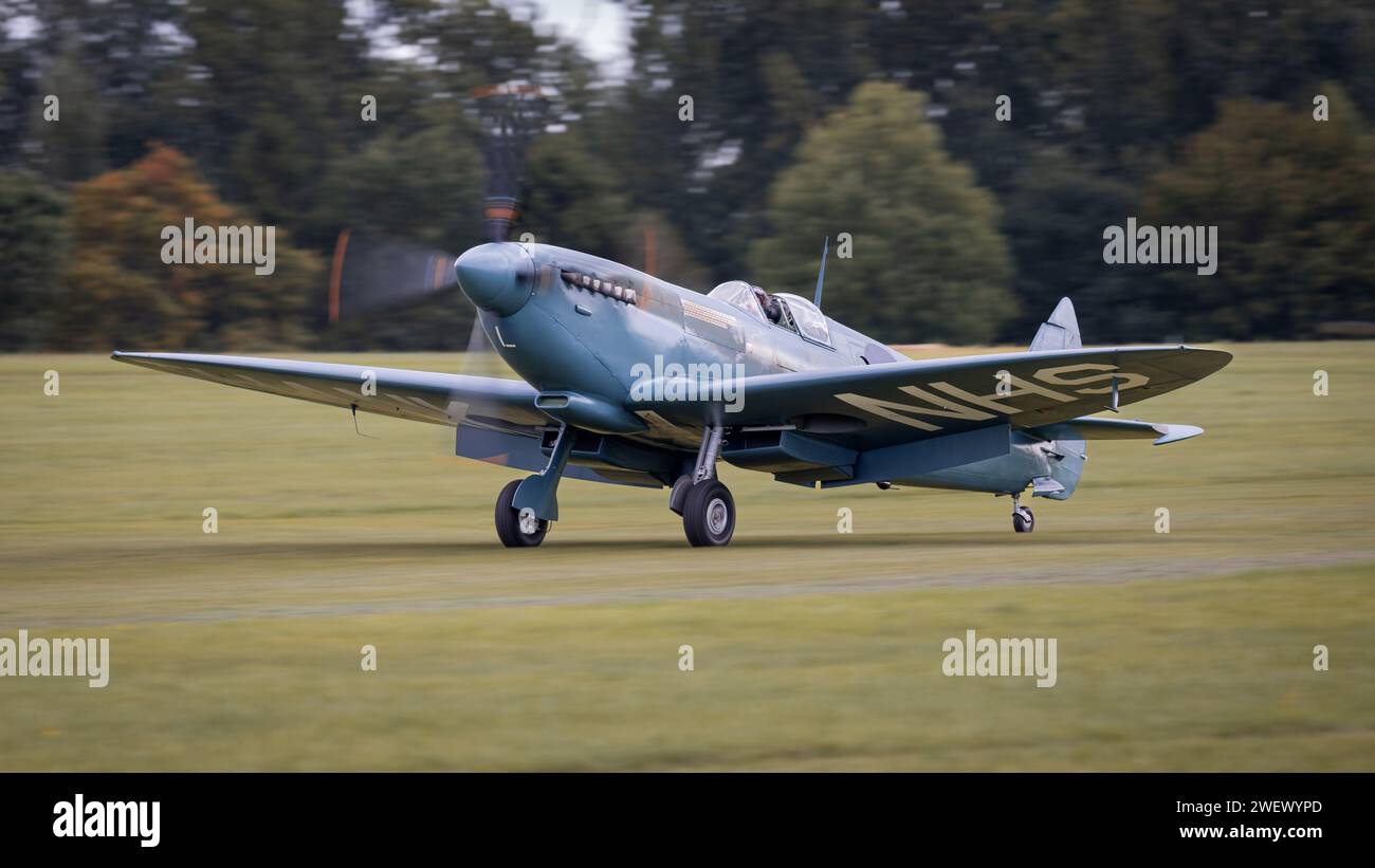 Old Warden,UK - 2nd October 2022: A British World War 2 Spitfire fighter aircraft, landing on a ...