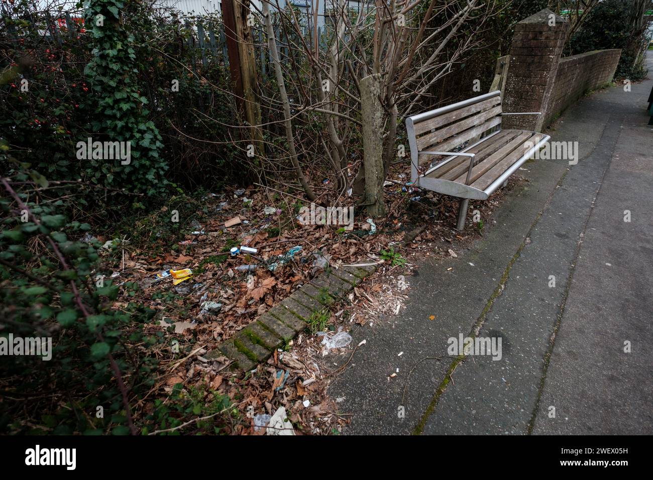 Huge amounts of litter build up next to bus stop in Bournemouth Dorset ...