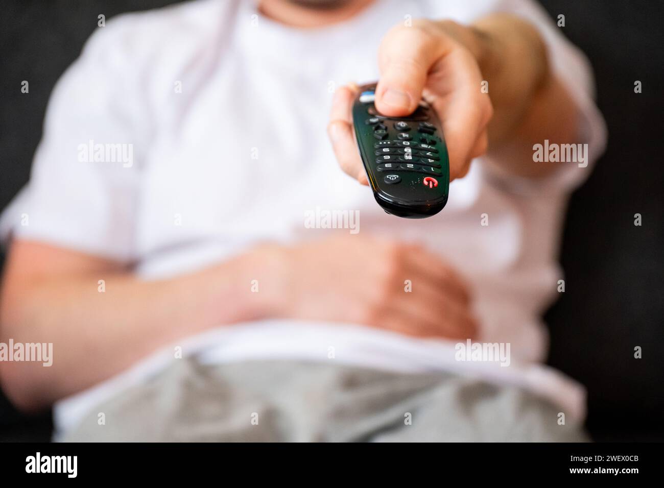 Male hand pointing a remote control hi-res stock photography and images ...