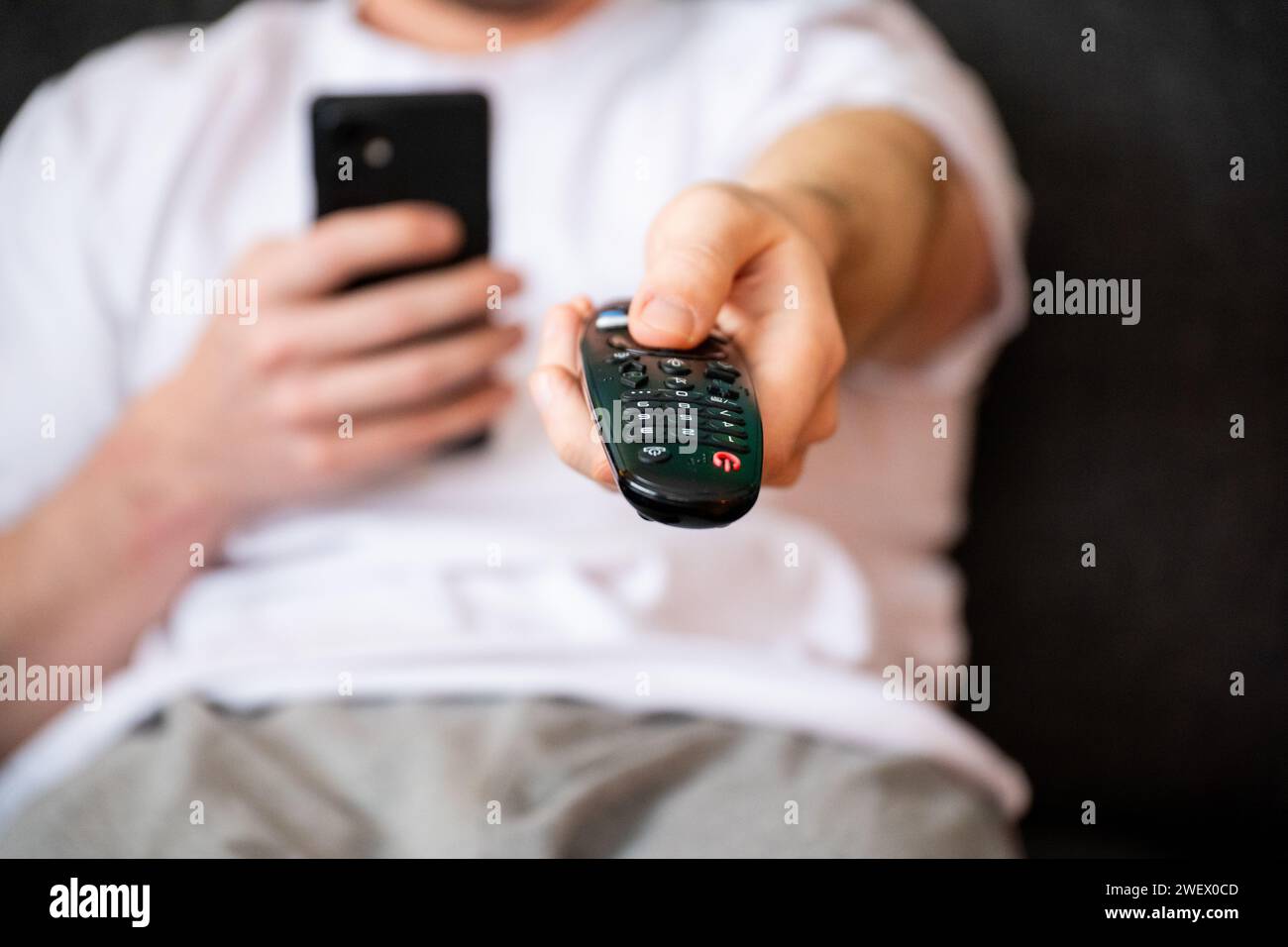 Male hand pointing a remote control hi-res stock photography and images ...