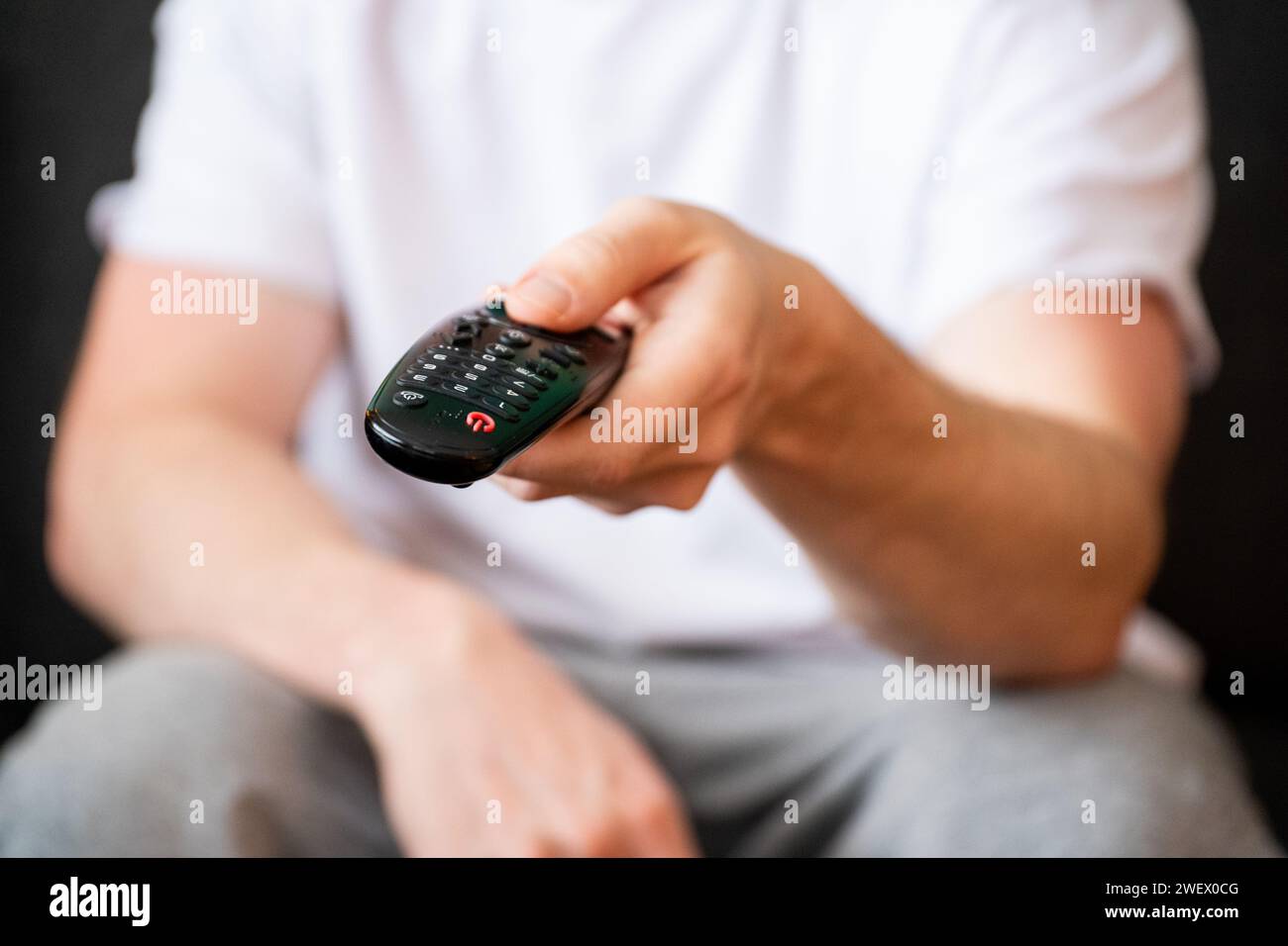 Male hand pointing a remote control hi-res stock photography and images ...