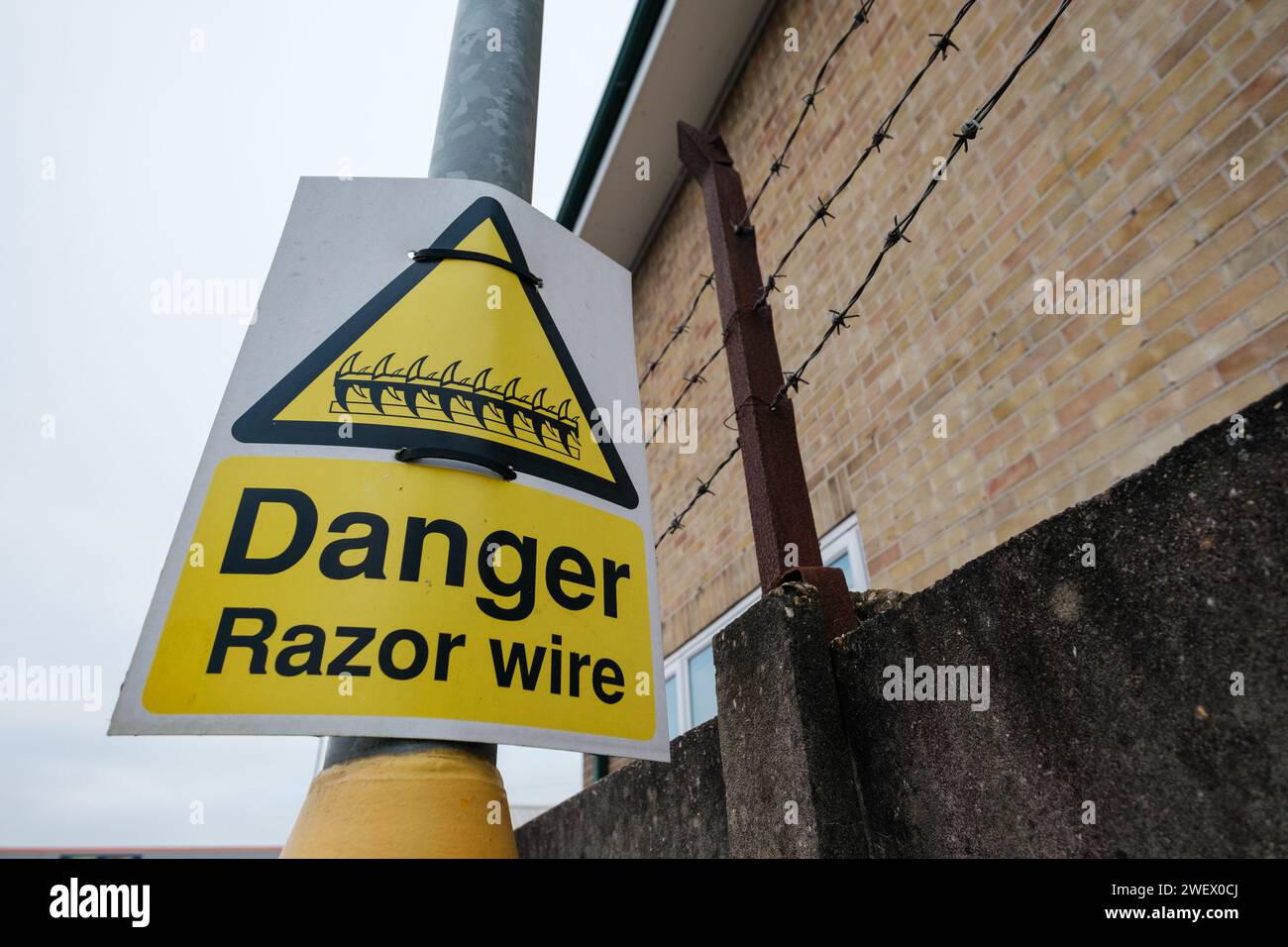 A warning sign to show Danger of Razor wire at a location to protect ...