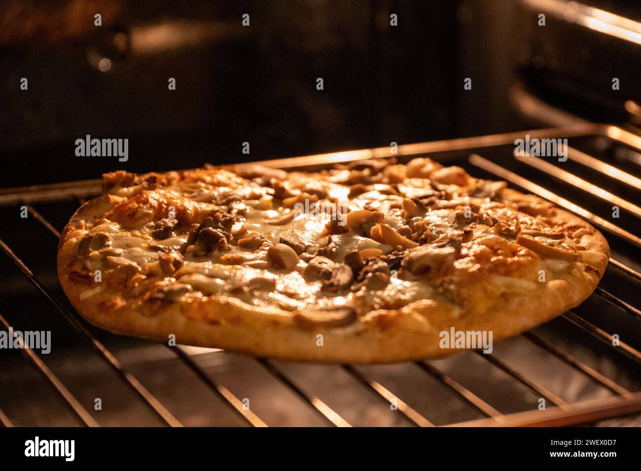Frozen pizza getting baked in hi-res stock photography and images - Alamy