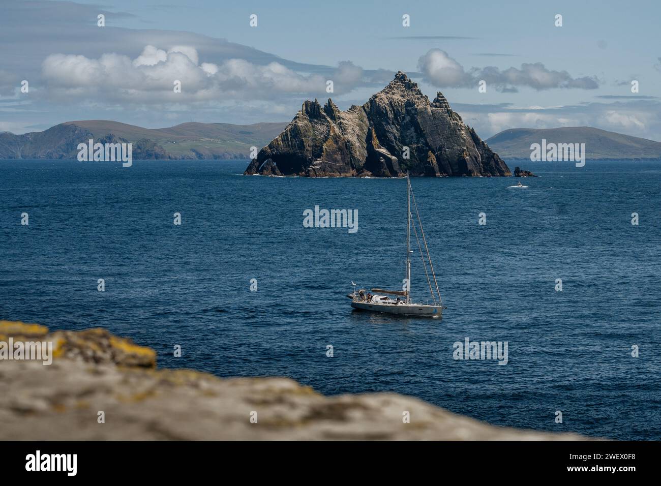 sailing boat in front of little skellig Stock Photo - Alamy