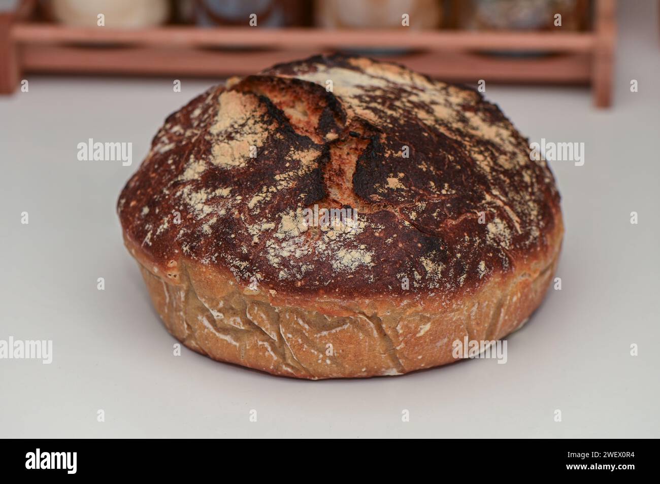homemade bread in the kitchen on a white table 2 Stock Photo - Alamy