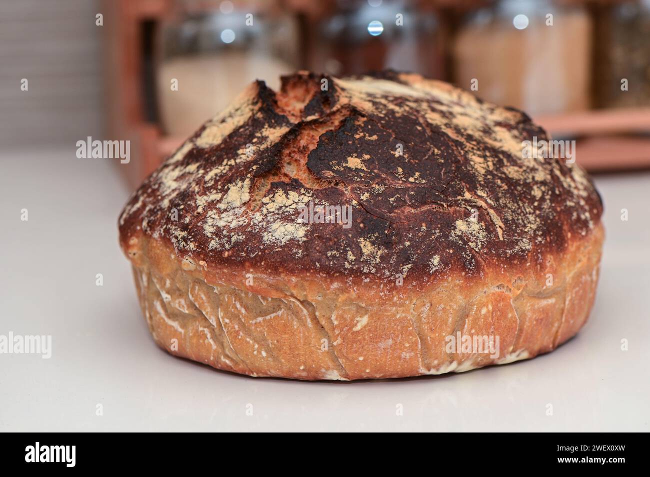 homemade bread in the kitchen on a white table 1 Stock Photo - Alamy