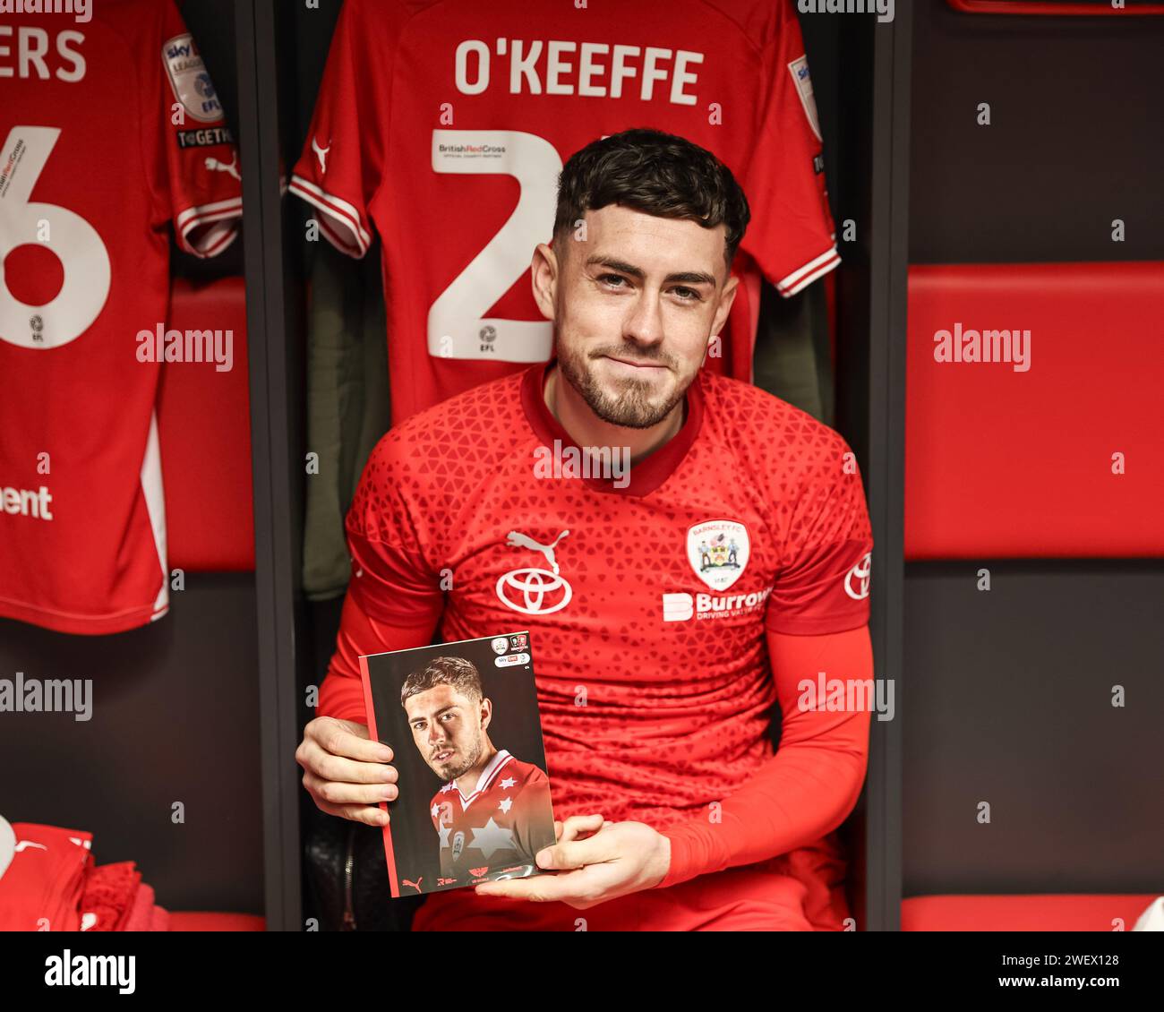Corey O'Keeffe of Barnsley with todays match day program photographed by Barry Cotter of ...