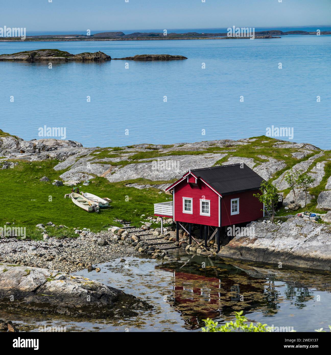 Traditional rorbu red cabin on the island of Heroy, Norway Stock Photo ...