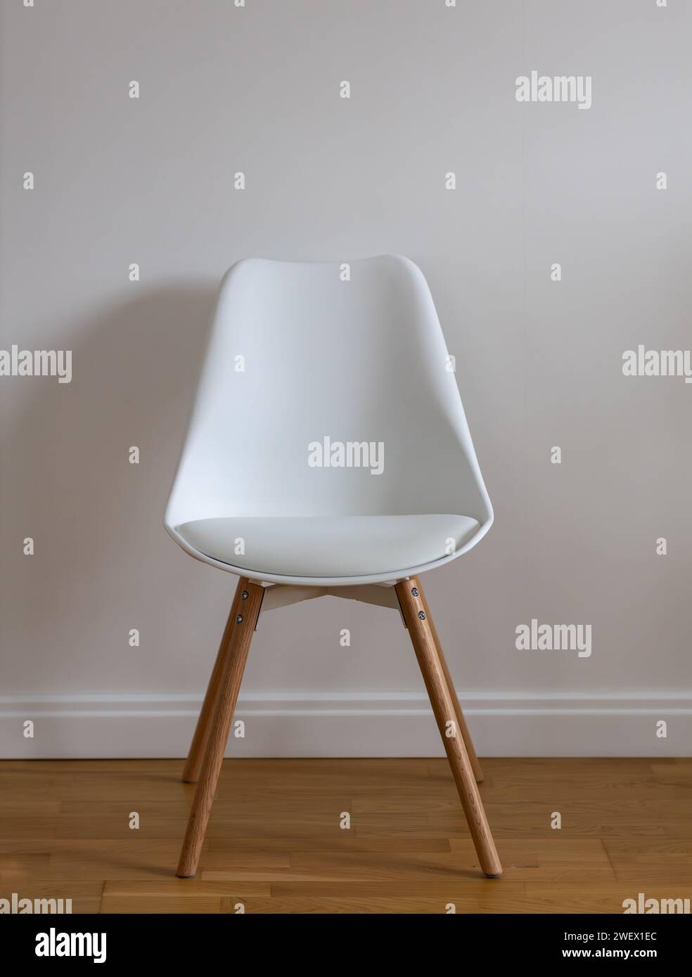 Stylish chair against wall hi-res stock photography and images - Alamy