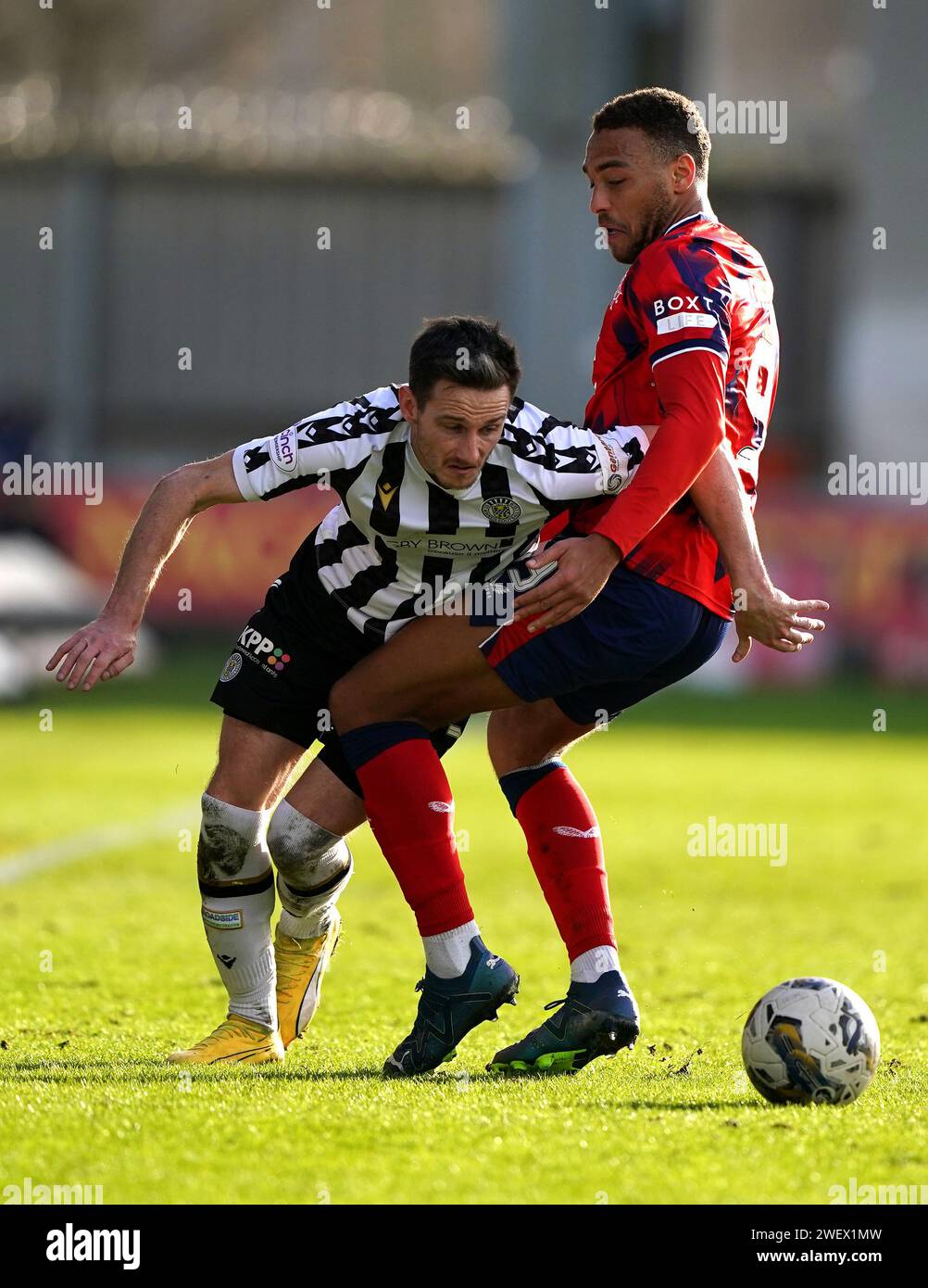St Mirren's Scott Tanser (left) and Rangers' Cyriel Dessers battle for ...