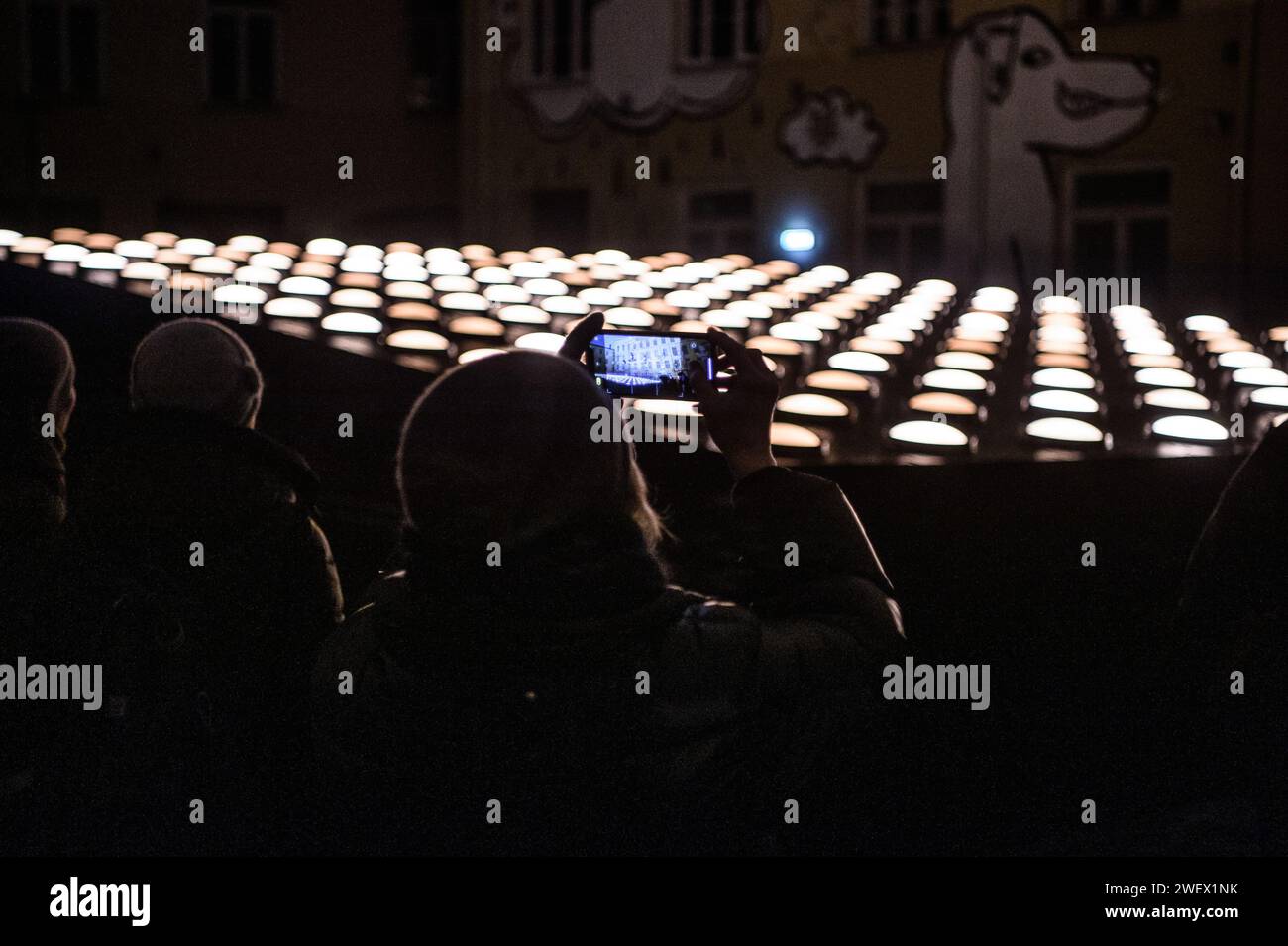Vilnius, Lithuania. 26th Jan, 2024. People watch the light installation ...