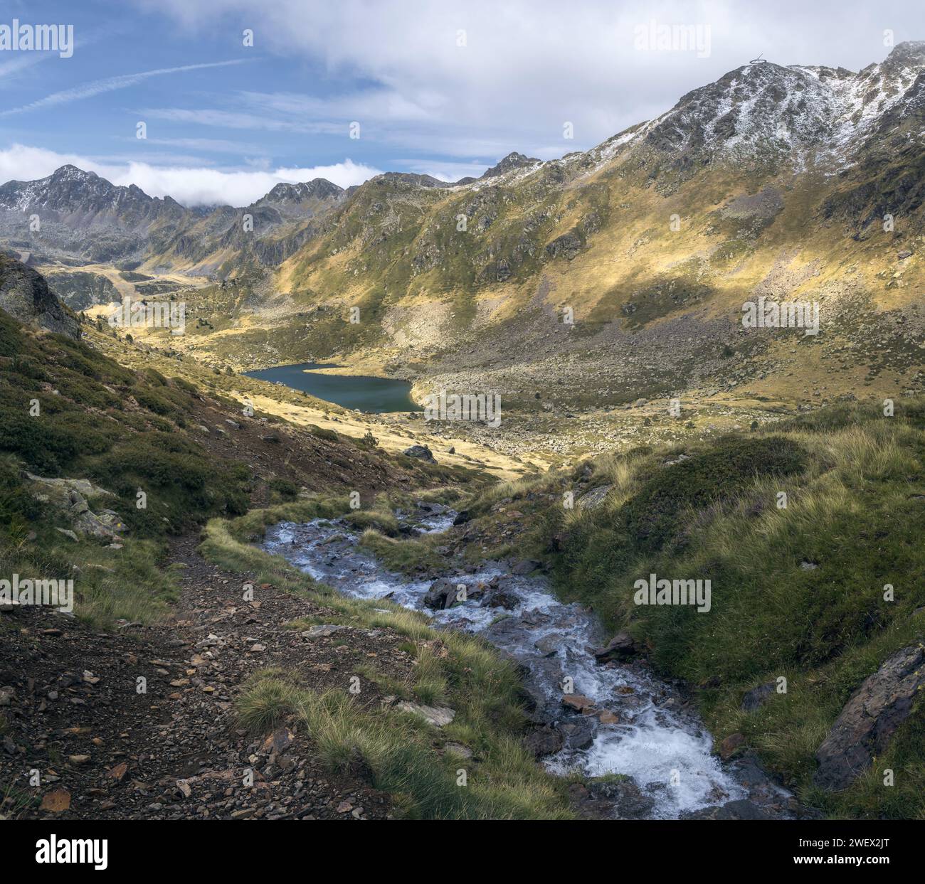 Stream flowing towards lake Tristaina in the Pyrenees, Andorra Stock ...