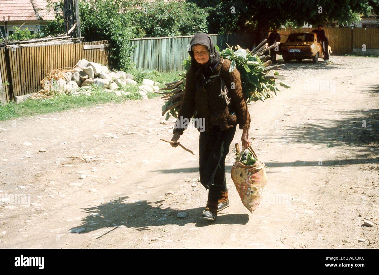 Carrying bundle on back hi-res stock photography and images - Alamy