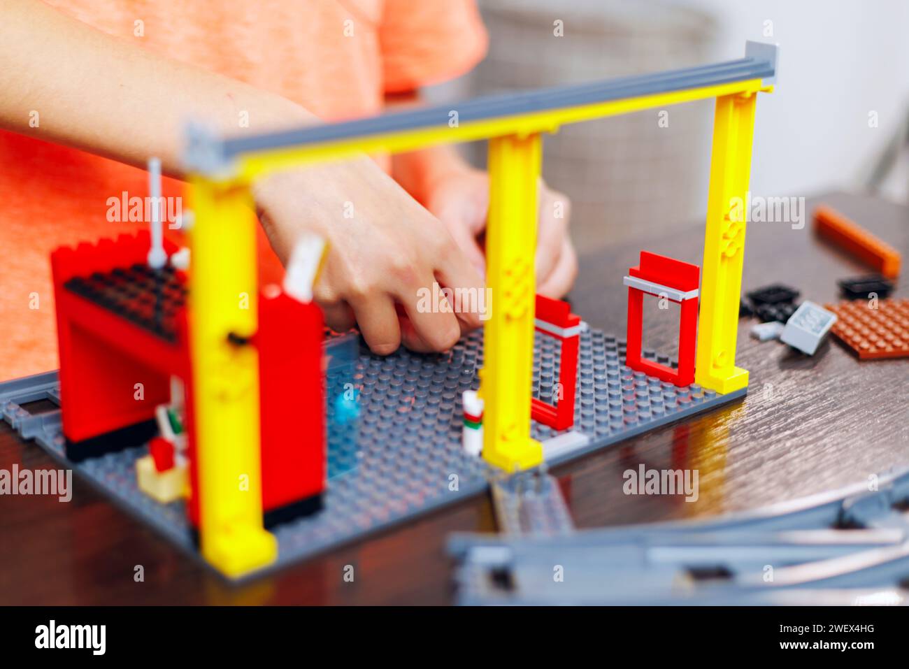 Child Building with Colorful Toy Construction Set Stock Photo - Alamy