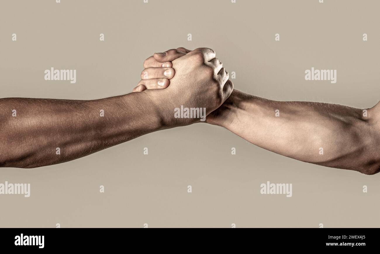 Two hands, helping arm of a friend, teamwork. Friendly handshake ...