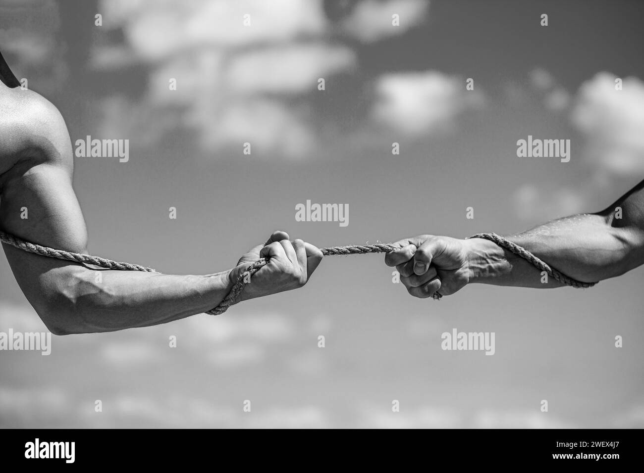 Hand pulling a rope Black and White Stock Photos & Images - Alamy