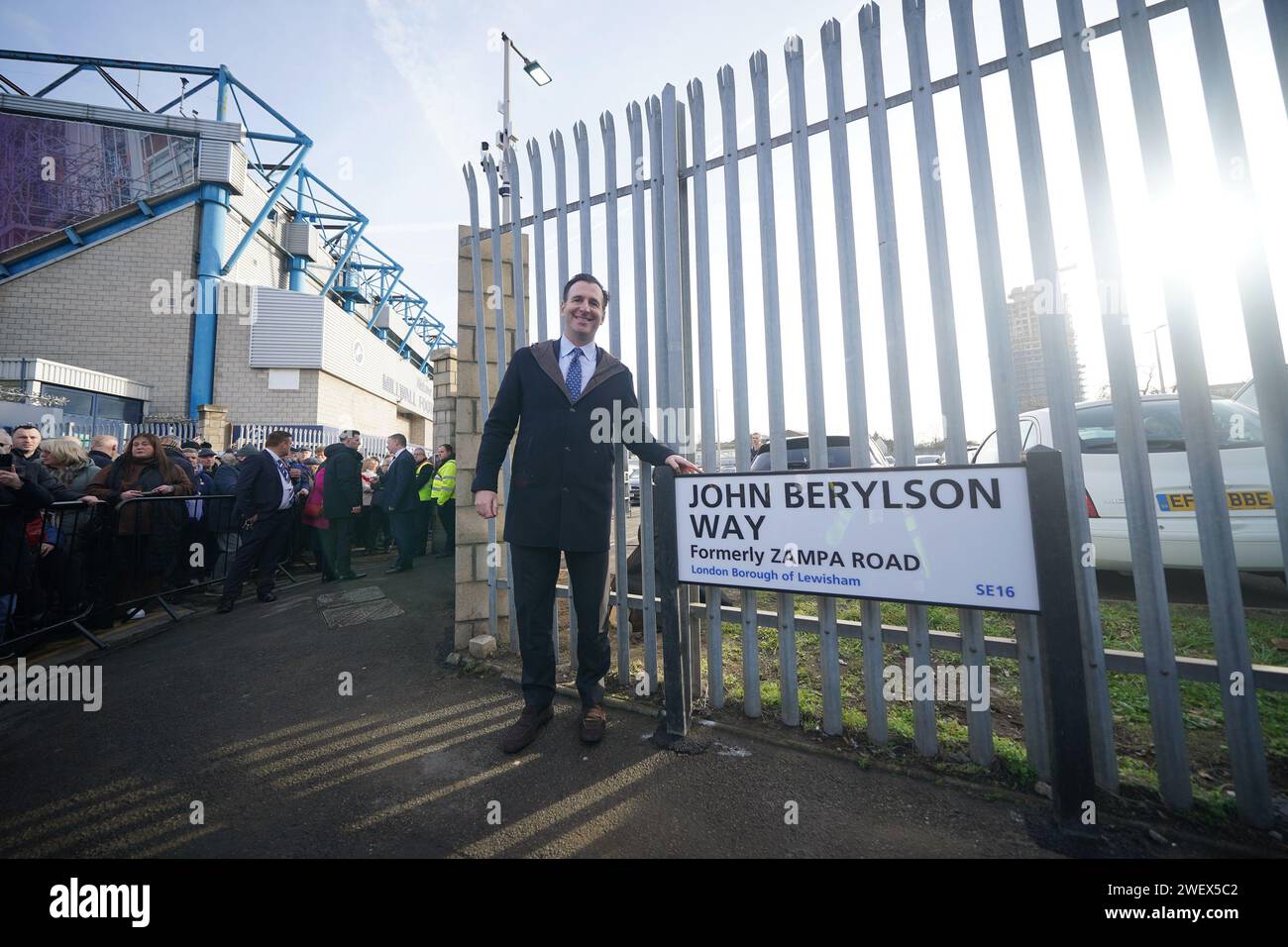 Millwall chairman James Berylson poses next to a road sign in tribute ...